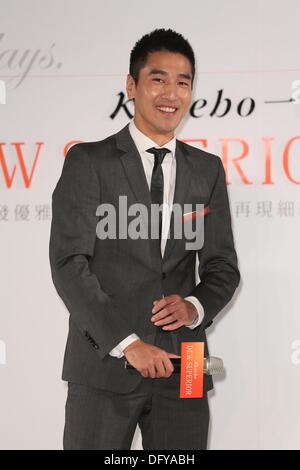Taipei, China. 8th Oct, 2013. Actor Mark Chao presents commercial ...