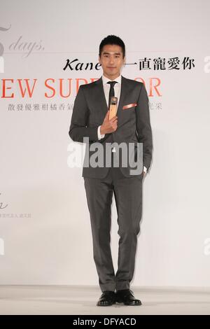 Taipei, China. 8th Oct, 2013. Actor Mark Chao presents commercial ...