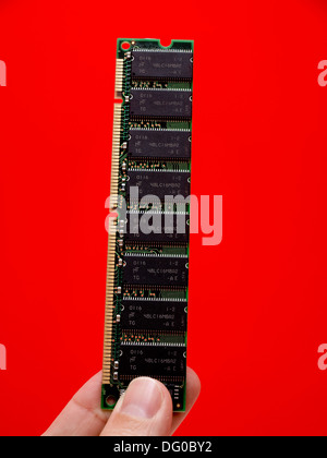 hand holding ram memory on black background Stock Photo - Alamy