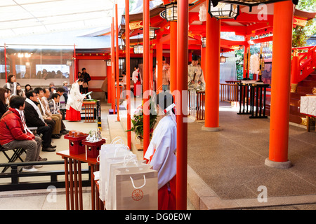 Kannushi Shinto priests and Miko Shrine Maidens conduct a ceremony ...