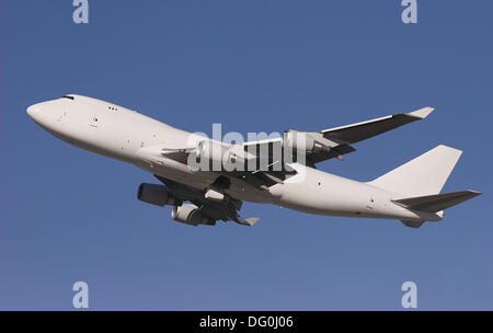An unmarked, all white, Boeing 747 Jumbo jet approaches landing at LAX ...