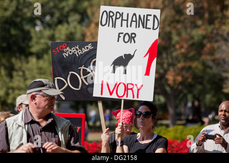 Elephant March demonstrators holding up signs protesting against ...