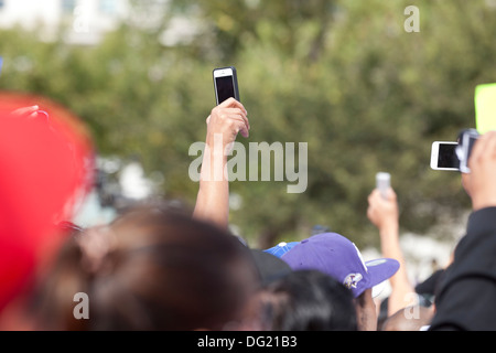 Man using iphone to video tape a speaker at a USDA event in New York ...