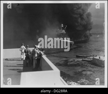 This photo captures a Pearl Harbor memorial ceremony aboard the USS ...