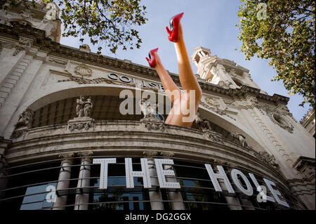 Huge woman inflatable legs at the facade of a theater (Coliseum 'The ...