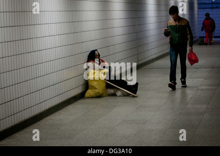 Beggar in underground passage in Beijing, China Stock Photo - Alamy