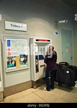 Interior of Woolwich Arsenal DLR Station showing DLR train at platform ...