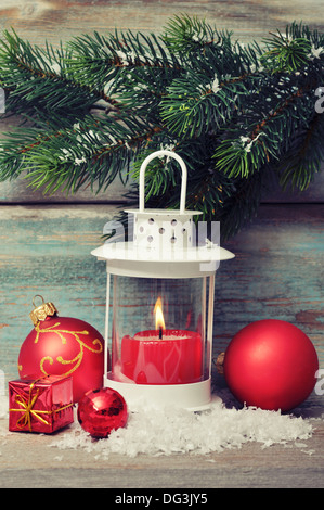 Christmas background with fir tree, candle and decorations on wh Stock ...