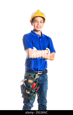 Indonesian Asian builder or construction worker with helmet and tool ...