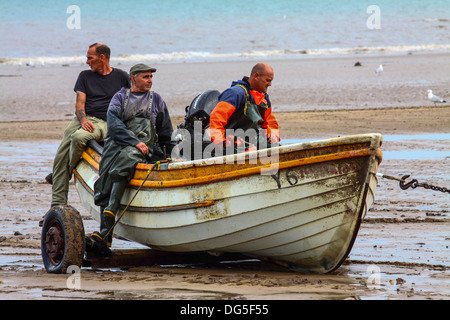 Yorkshire coble fishing boat with lobster pots on a bright winters day ...