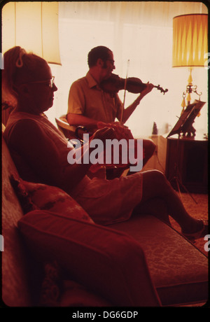 This photograph shows Ben and Hildred Ratner enjoying music in their ...