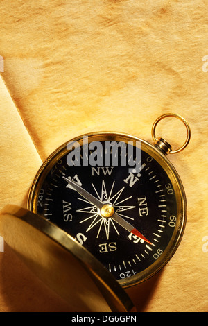 Vintage compass on blank yellowed paper Stock Photo - Alamy