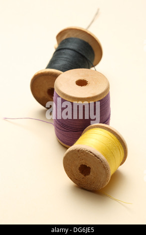 Thread bobbins on white background Stock Photo - Alamy