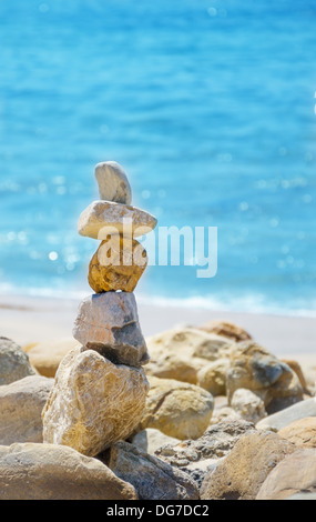 Stack of sea rocks balancing by Pacific ocean Stock Photo - Alamy
