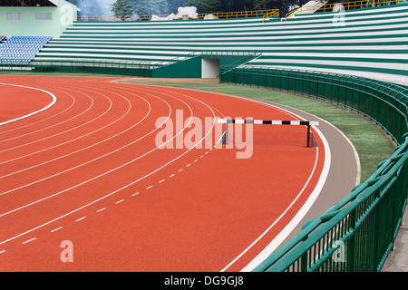 Red running racetrack on the stadium with two running legs Stock Photo ...