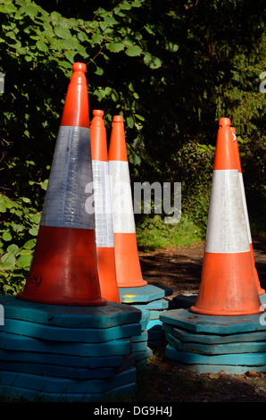 Stack of road cones or traffic cones stored or abandoned in a quiet ...
