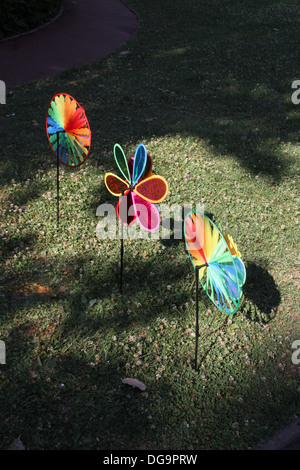colourful toy wind fans in garden Stock Photo - Alamy