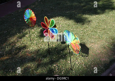 colourful toy wind fans in garden Stock Photo - Alamy