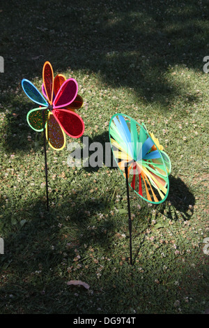 colourful toy wind fans in garden Stock Photo - Alamy