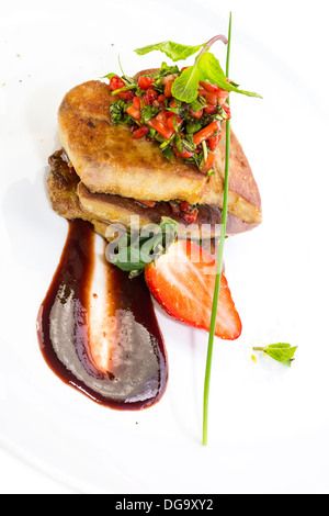 Roast goose liver is decorated with greens and strawberries Stock Photo ...