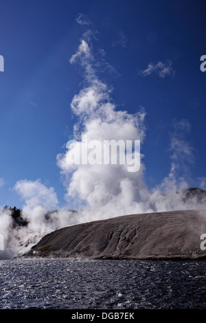 Scenic view of eruption by Firehole River in Midway Geyser at ...