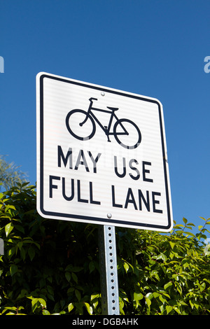 Road sign informing cyclist that they may use the full lane and not ...