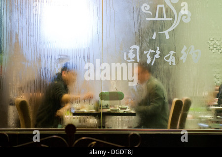 Two men in restaurant in Shanghai, China Stock Photo - Alamy