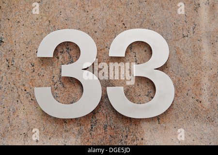 Number thirty-three (number 33) with red transparent stripe on white ...