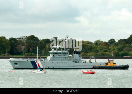 UK border force ship being towed in Portsmouth Harbour after refit ...