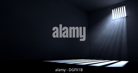 An old jail cell interior with barred up window with light rays penetrating through it ...