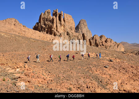 Group of hikers at the diatreme, volcanic pipe of Tahat mountain ...