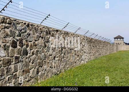 Austria, wall with barbed wire fence in NS concentration camp ...