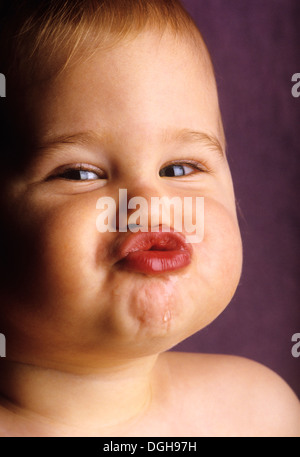 Portrait of a boy puckering his lips Stock Photo - Alamy
