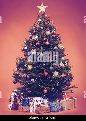 Beautiful Decorated Christmas tree on a darl background Stock Photo - Alamy