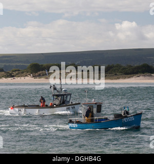 Fishing boats moored in Poole Harbour, Dorset, UK Stock Photo: 24983410 ...