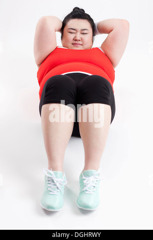 a fat girl working out in a gym outfit Stock Photo - Alamy