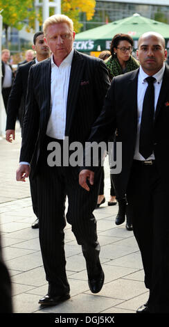 Tennis ace Boris Becker walks along Miami Beach boardwalk yawning and ...