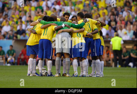 Brazilian football player in team Brazil colors holding trophy up on ...