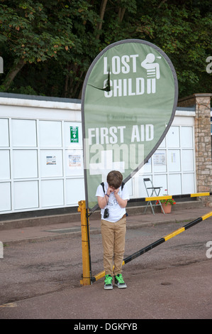 First aid post lost children Information point sign on black shed Stock ...