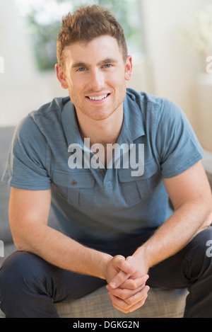 Young redhead man smiling confident training using fit ball at sport ...
