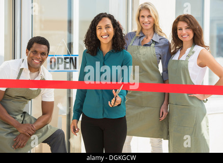 Starting and opening a small business, a young Asian woman showing a ...