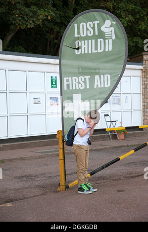 First aid post lost children Information point sign on black shed Stock ...