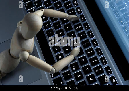 Mannequin at the keyboard, symbolic image for human beings and ...