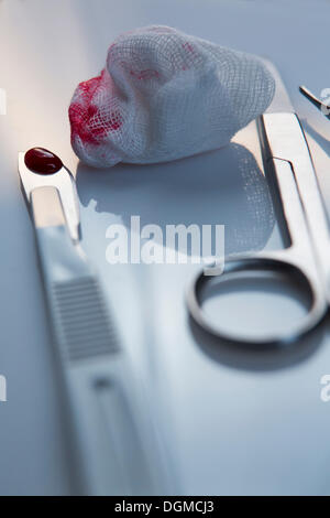 Blood on cotton swab and surgical scissors Stock Photo - Alamy