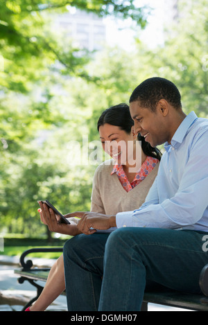 Selective focus of african woman keeping pen and writing on tablet ...