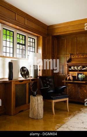 1930s 1940s INTERIOR OF LIBRARY ROOM WITH CHINTZ COVERED CHAIRS AND ...