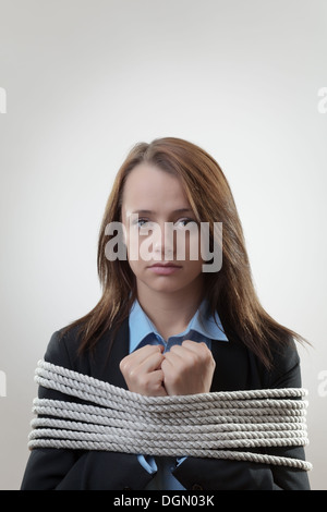Woman hand tied up with rope Stock Photo - Alamy