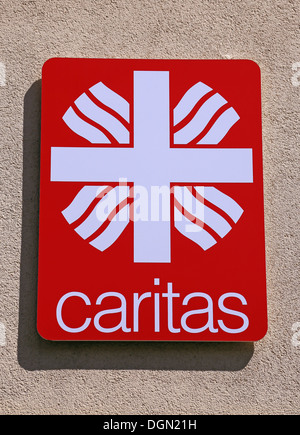 Sign, logo of Caritas, on a white wall, Deutscher Caritasverband e.V ...