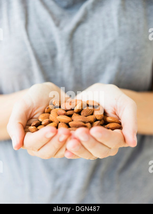 Close up shot of female hands holding a small gift Stock Photo - Alamy
