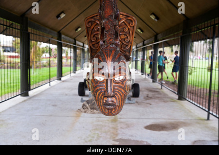 Maori Waka taua (war canoe) launching off beach at Waitangi during ...
